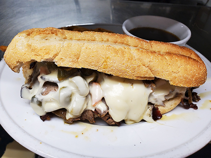 The French dip sandwich that launched a thousand road trips. Tender beef, melty cheese, and a crusty roll that's the perfect delivery system.