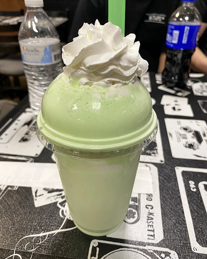 This mint-green masterpiece topped with whipped cream isn't just a shake—it's dessert with drinking privileges. Sip slowly to avoid brain freeze regret.