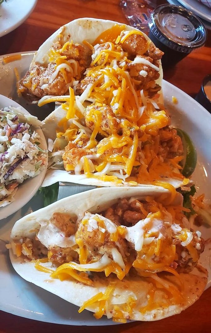 These shrimp tacos aren't just food—they're little handheld celebrations topped with enough cheese to make Wisconsin nervous.
