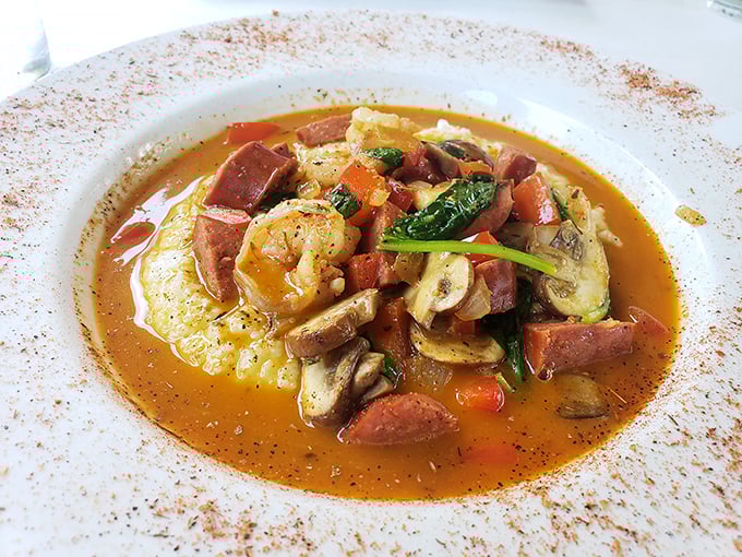 This isn't just shrimp and sausage swimming in sauce—it's a spicy southern hug in a bowl. The rim dusted with spice is the culinary equivalent of a chef's kiss.