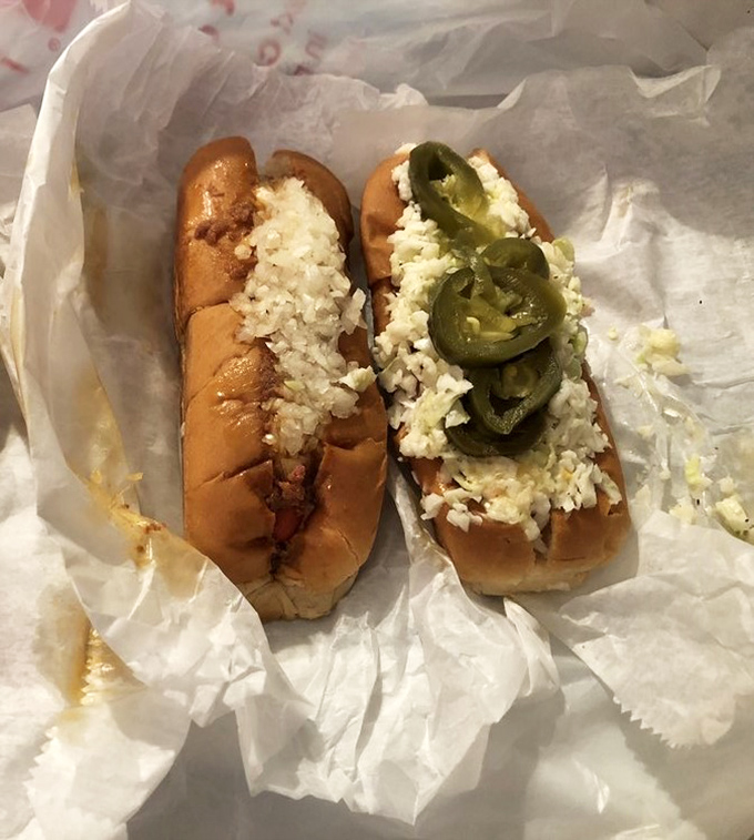 The dynamic duo of Jimmie's offerings: one classic with crisp slaw, one adventurous with pickled jalapeños. Choose your fighter or order both—no judgment here.