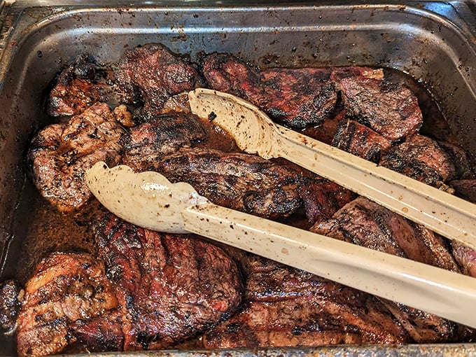 These smoked ribeye steaks aren't just cooked—they're respected. The char marks tell stories of perfect heat and patient preparation.