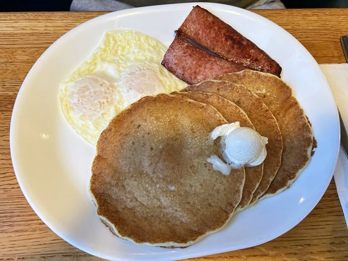 Golden-brown pancakes with a perfect pat of butter melting on top—the breakfast equivalent of winning the lottery without having to share.