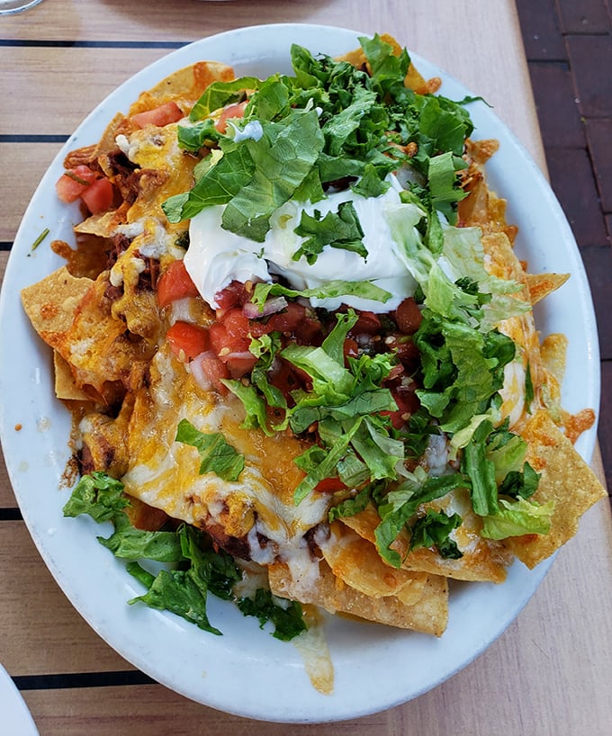These loaded nachos aren't just a starter—they're practically a declaration of delicious independence with every colorful, cheese-draped bite.