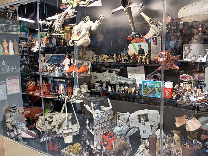 The Force is particularly strong in this display case. A meticulously curated galaxy of Star Wars treasures spans generations of Jedi dreams.