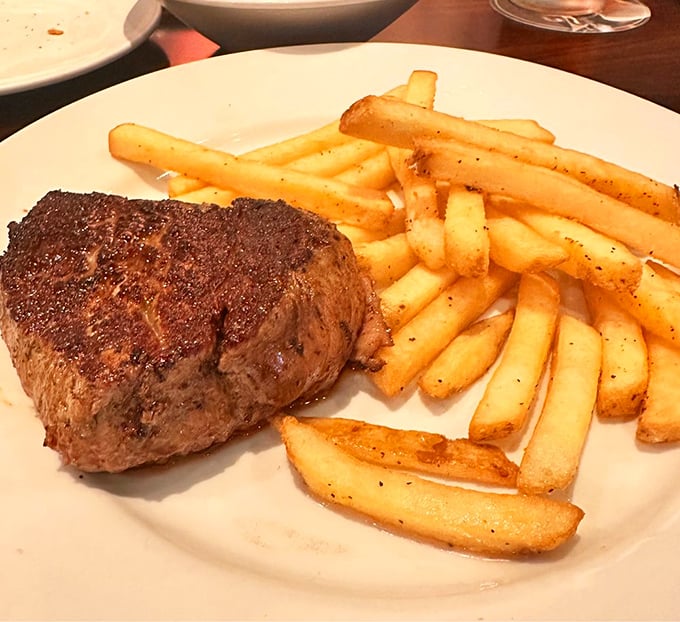 Sometimes simplicity speaks volumes. This perfectly seared steak alongside golden fries is the culinary equivalent of a greatest hits album—no filler, all killer.