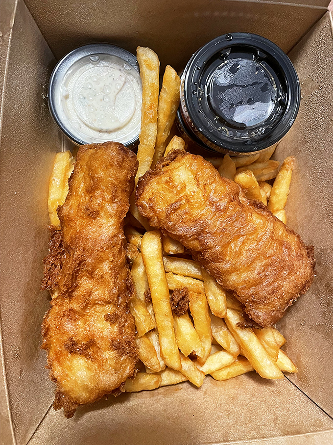 Even takeout maintains the golden-ratio perfection. Fish and chips that survive the journey home without sacrificing their crispy dignity.