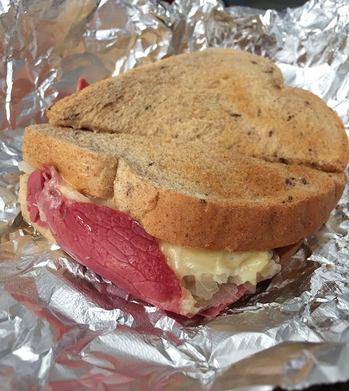 This isn't just a sandwich—it's a masterpiece on rye. The perfect ratio of meat to kraut that would make even New York delis jealous.