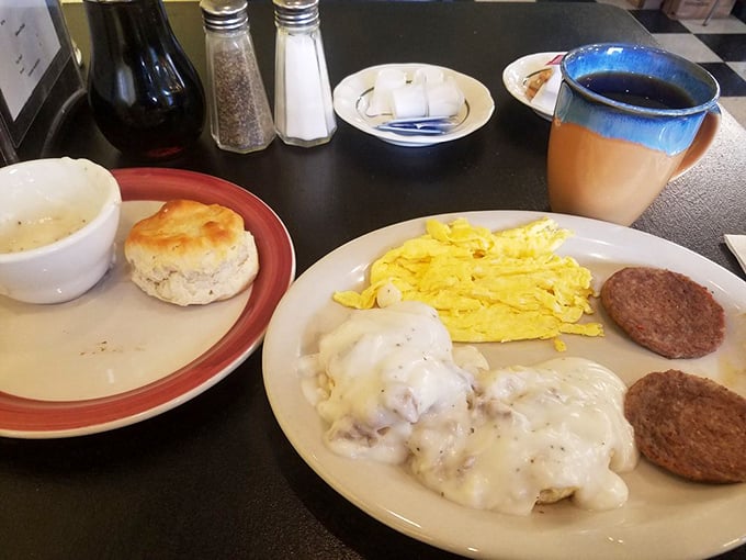 Biscuits and gravy that could settle regional disputes, alongside eggs and sausage patties that remind you why breakfast deserves its legendary status.