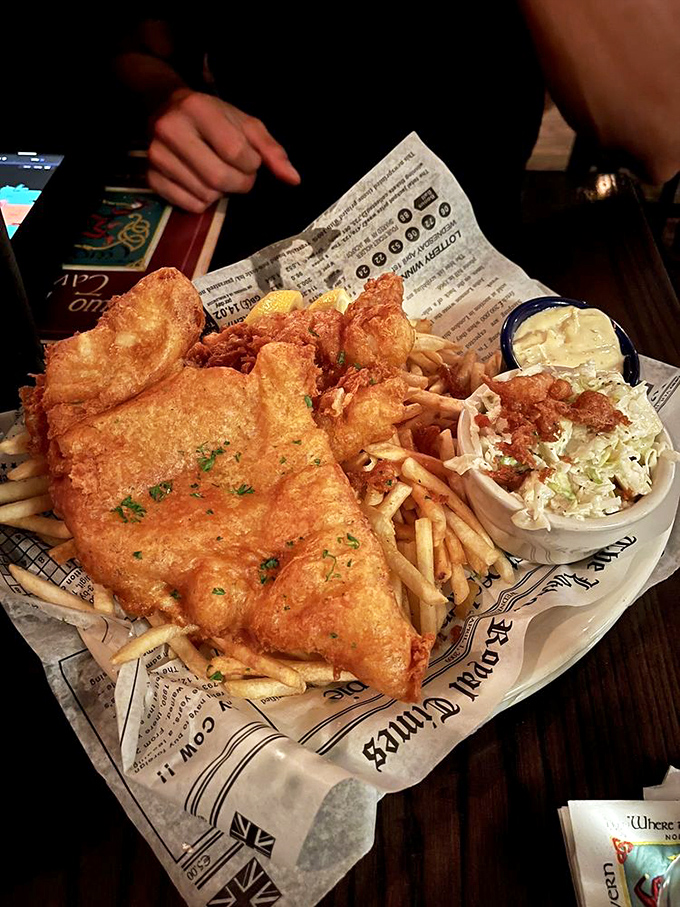 Crispy on the outside, flaky on the inside—this fish and chips plate isn't just food, it's edible architecture with a side of comfort.