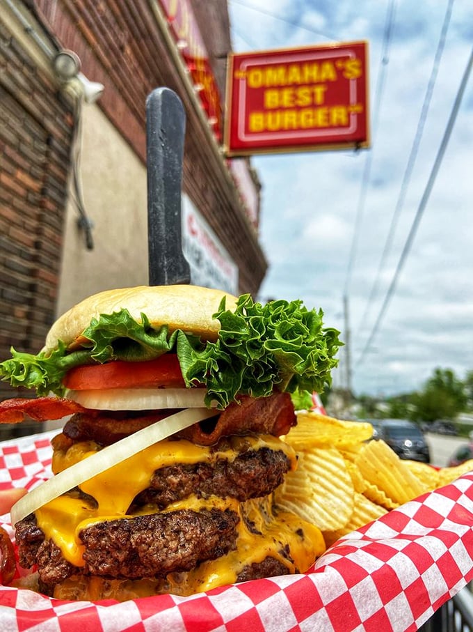 The Triple Decker in its natural habitat. This isn't just a burger—it's a skyscraper of flavor demanding your full attention.