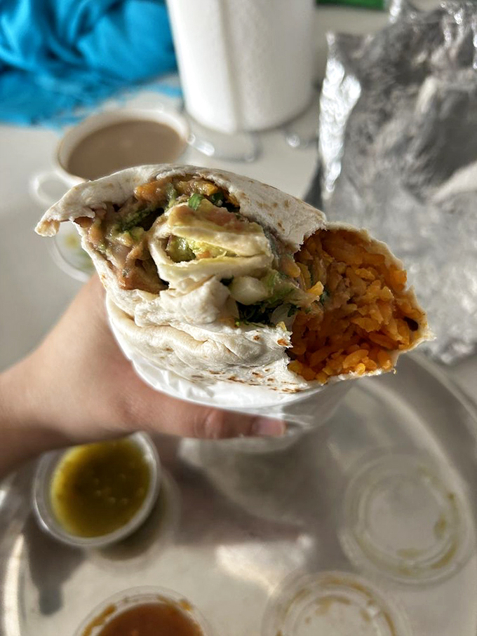 A cross-section that reveals the architectural marvel within—layers of flavor carefully constructed like the world's most delicious Jenga tower.