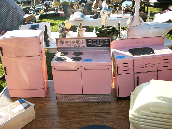 The kitchen of yesteryear in bubblegum pink! These vintage toy appliances have seen more imaginary meals than a 1950s sitcom housewife.