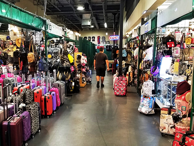 Luggage in every color of the rainbow lines this corridor, ready to carry home all the treasures you never knew you needed.