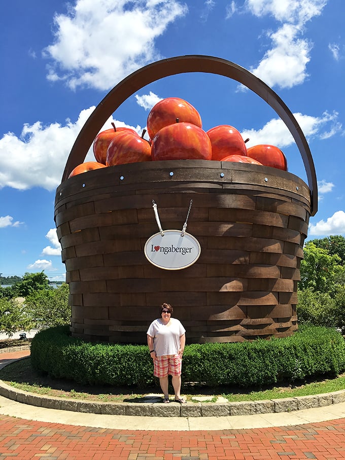 Human for scale! This visitor demonstrates the proper reaction to encountering a basket bigger than your first apartment.