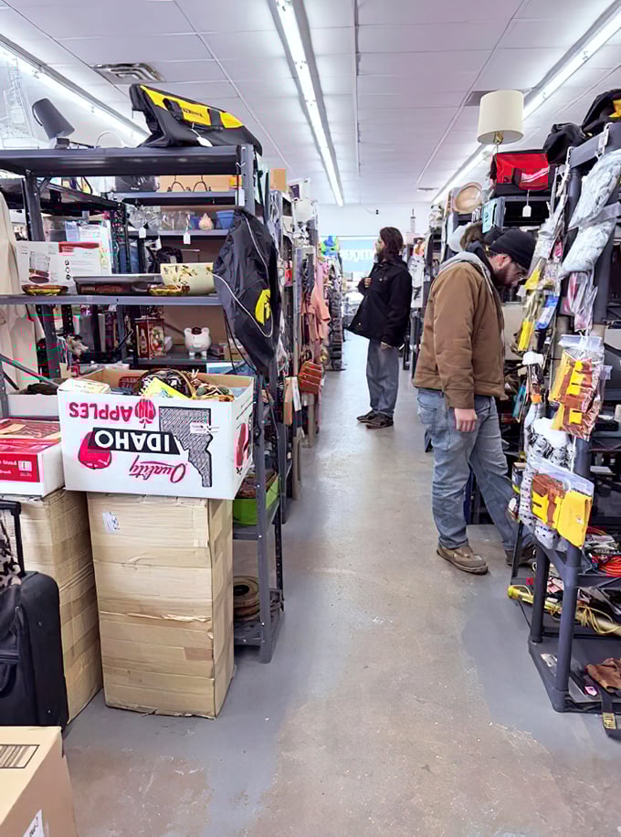 Treasure hunters navigate narrow aisles packed with possibilities. The serious expressions say it all—this isn't shopping, it's a mission.