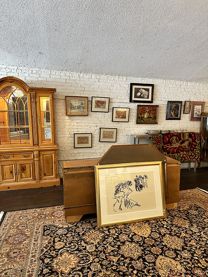 Furniture time travel at its finest. That floral-patterned couch has seen things, while the wooden dresser holds secrets from another era entirely. 