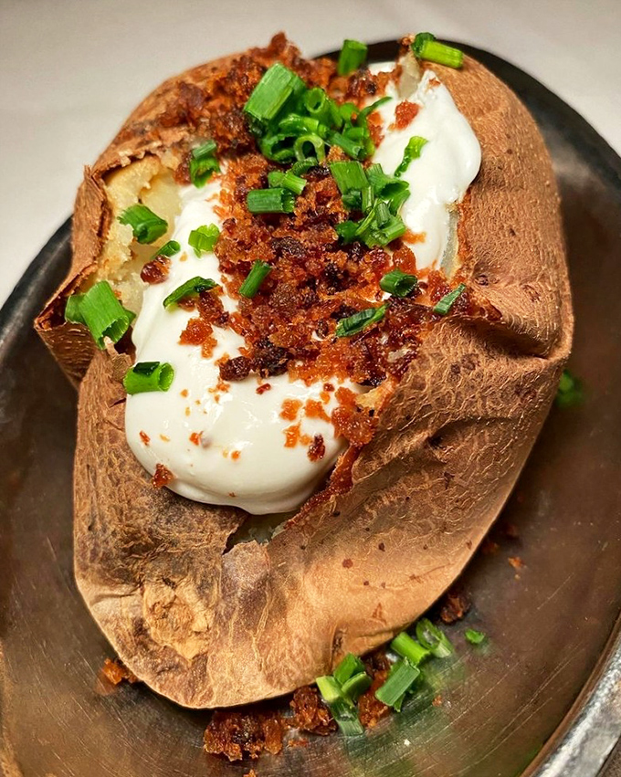 Not just any baked potato—this loaded beauty comes dressed for the occasion with all the fixings. Potato perfection that makes French fries jealous.