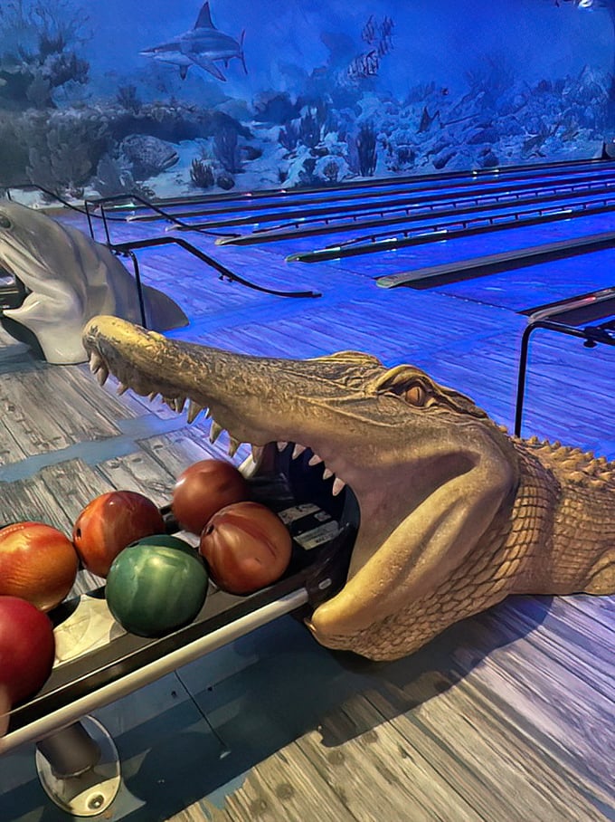 Even the ball returns are part of the theme—this gator's got quite an appetite for bowling balls rather than the usual tourist fare.