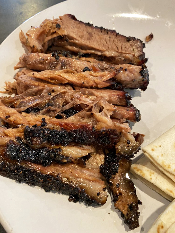 Brisket sliced to perfection reveals that coveted pink smoke ring – the barbecue equivalent of finding the Hope Diamond in your backyard.
