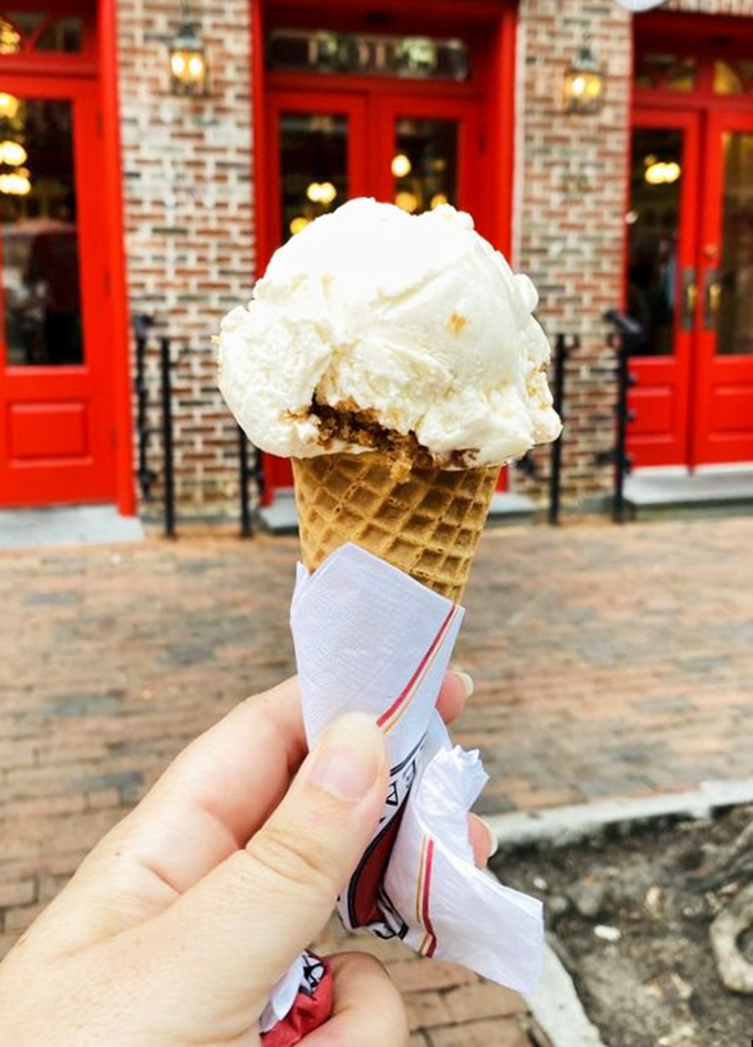 A scoop of vanilla perched proudly on a freshly-made waffle cone—proof that sometimes the simplest pleasures make the most profound memories.