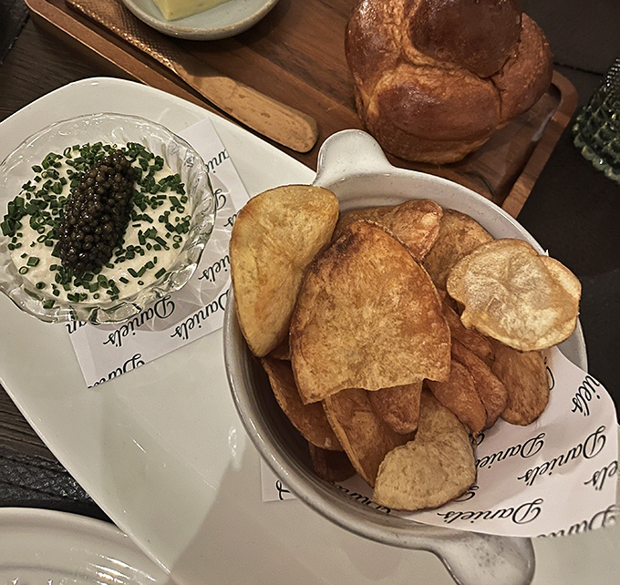 Caviar service that makes you feel like royalty, paired with house-made chips that somehow make luxury feel comfortingly familiar.
