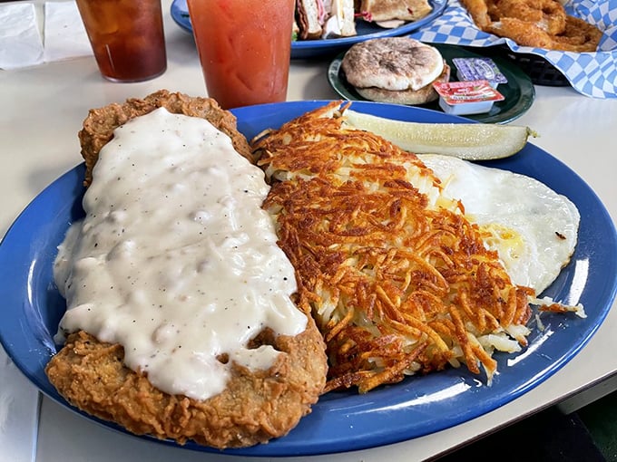This isn't just chicken fried steak—it's a golden-crusted masterpiece with hashbrowns so crispy they deserve their own fan club.