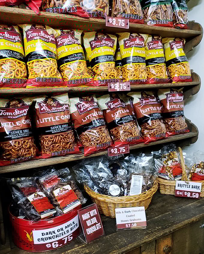 Shelf after shelf of pretzel varieties—like a library where you're encouraged to eat the books. Tom Sturgis continues the family tradition.