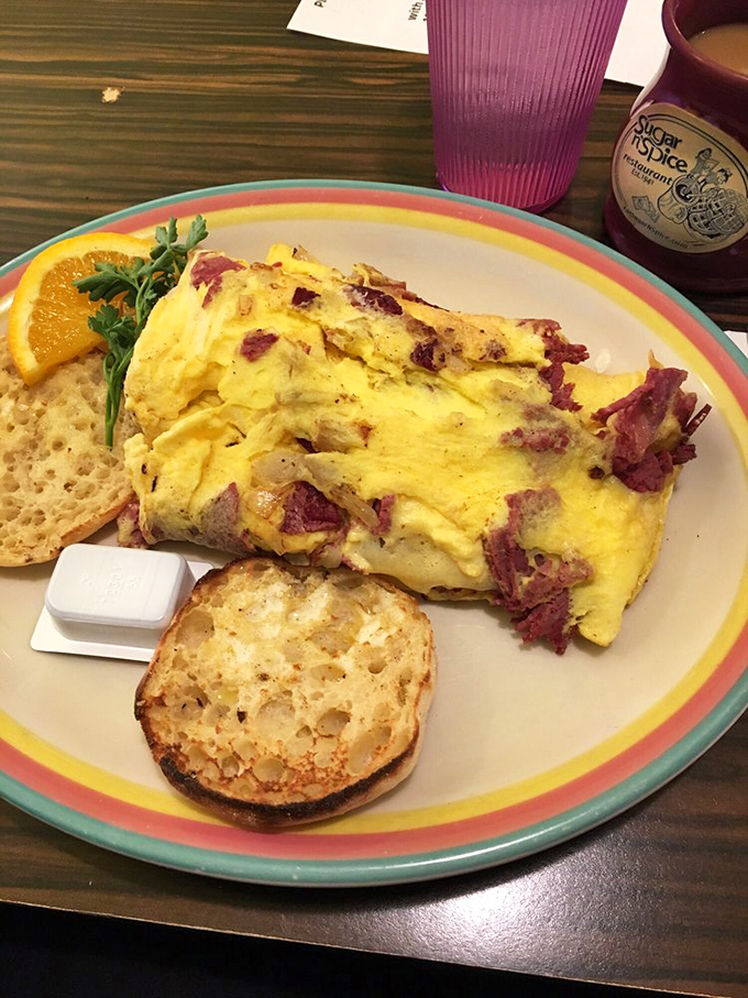This isn't just an omelet—it's a corned beef revelation. Fluffy eggs embrace savory meat in a relationship more perfect than most Hollywood marriages.