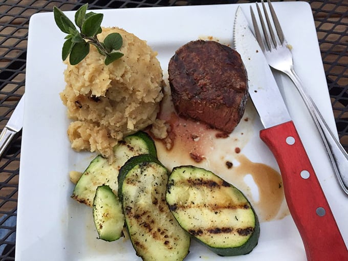 Perfectly seared filet mignon alongside golden mashed potatoes and grilled zucchini—proof that sometimes the classics are classics for good reason.