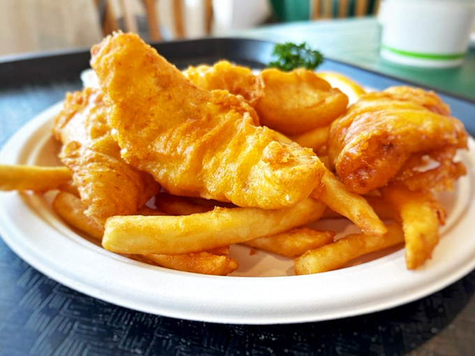 Golden-battered fish and chips that crackle with each bite—the kind that makes you wonder why you ever settled for frozen fish sticks in your formative years.