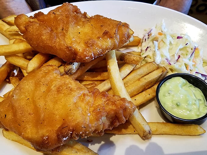 Golden-battered fish that crunches like your favorite childhood memory, paired with fries that achieve the perfect balance between crisp exterior and fluffy interior.