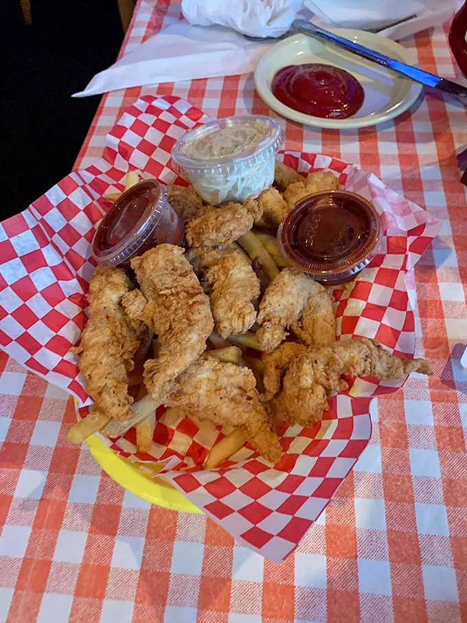 Crispy fried shrimp nestled among golden fries—a seafood treasure chest that Captain Jack Sparrow would happily trade his ship for.