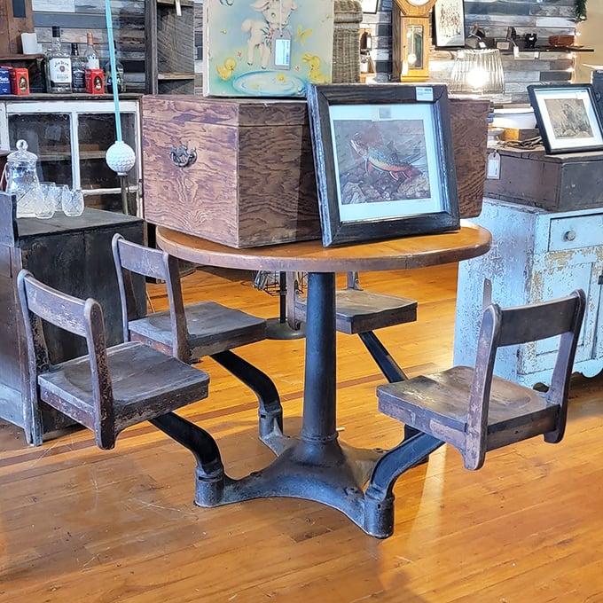 Not just a table—this industrial masterpiece with attached school chairs is what happens when function and history have a beautiful collision.