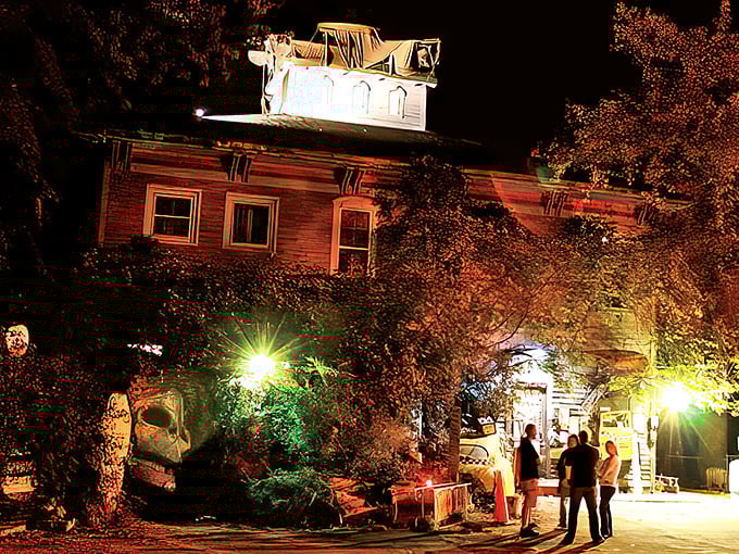 As twilight embraces this historic building, the warm glow of lights transforms an ordinary evening into something magical—small-town enchantment at its finest.