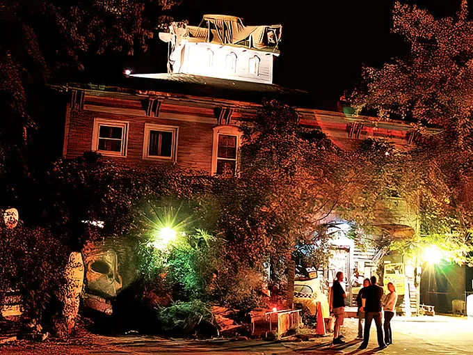 As twilight embraces this historic building, the warm glow of lights transforms an ordinary evening into something magical—small-town enchantment at its finest.