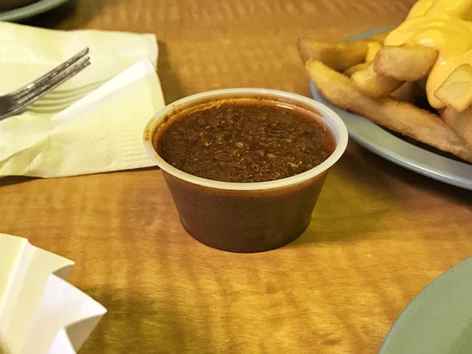This isn't just chili—it's a slow-simmered commitment to flavor that makes every hot dog it touches ascend to a higher plane of existence.