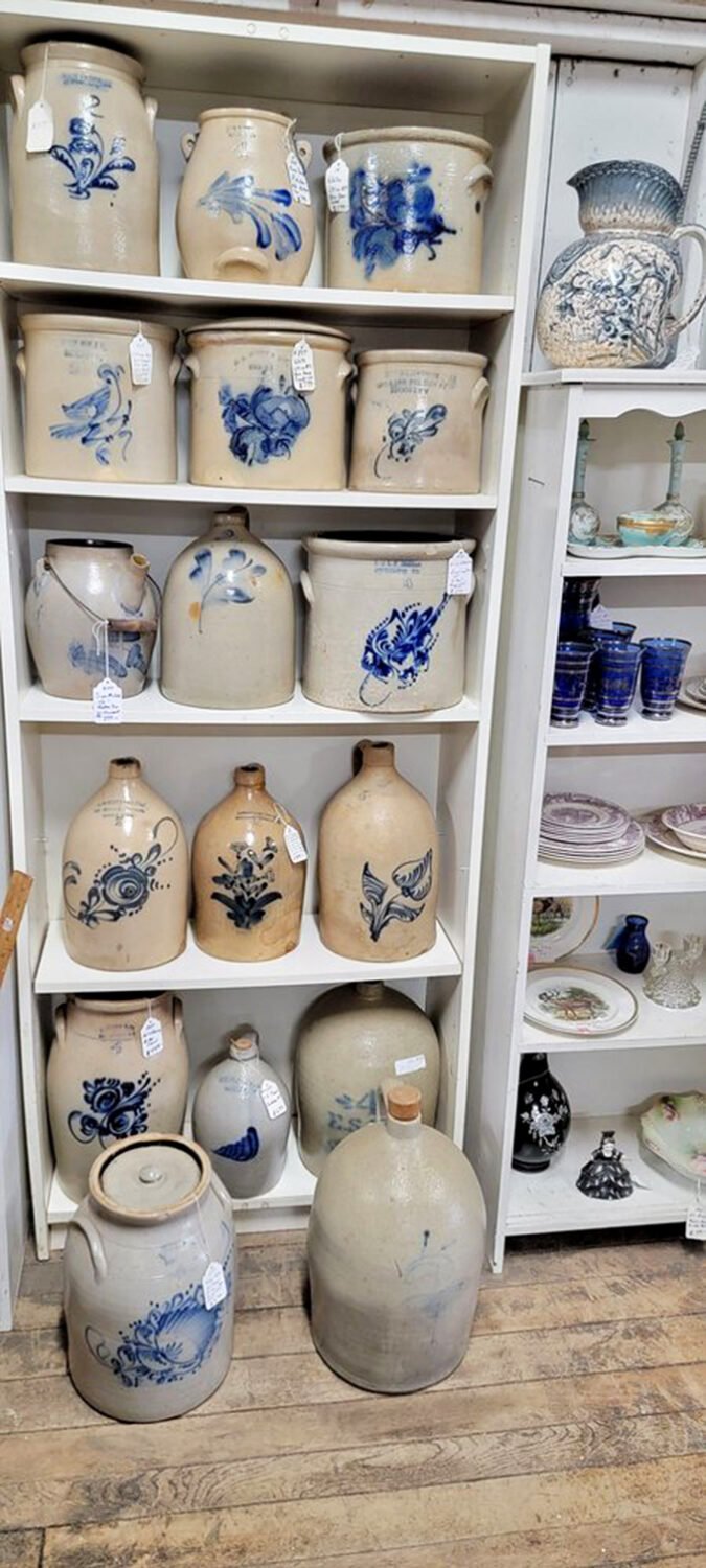The blue-decorated stoneware collection looks like it sailed straight out of a Pennsylvania farmhouse kitchen circa 1880. Each jug whispers tales of pickles past.