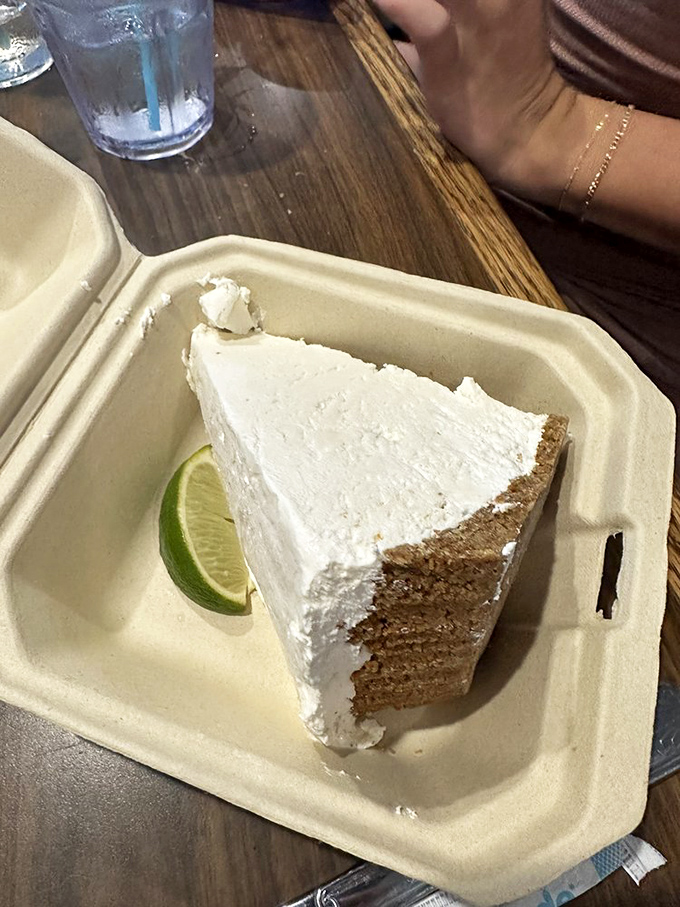 The Mile High Key Lime Pie lives up to its name—towering with creamy, tart perfection. Florida on a plate, with that essential lime wedge standing by.