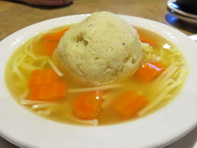 The matzo ball soup at Ben & Irv's – where the dumplings float like celestial bodies in a universe of golden chicken broth. Jewish penicillin at its finest.