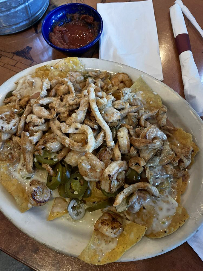 When protein meets cheese meets jalapeños in perfect harmony, you don't just eat nachos—you experience them. This plate is Mexican meditation.