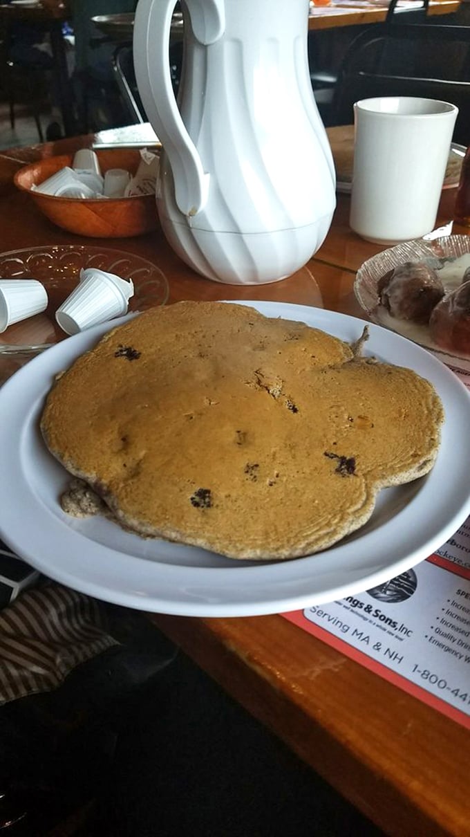 Blueberry pancakes so perfectly golden they make you wonder if they hired the sun as their personal chef.
