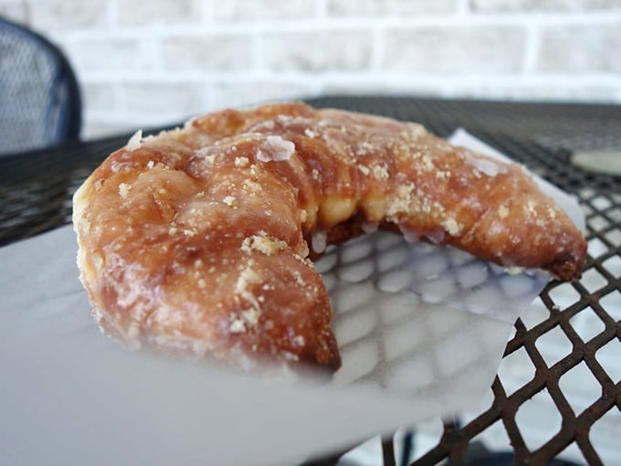 That glistening, sugar-dusted crescent isn't just a pastry—it's edible architecture. Flaky, buttery, and guaranteed to leave evidence on your shirt.
