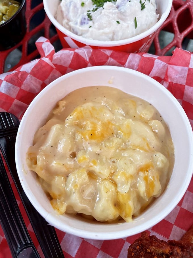 The pimento mac and cheese arrives like a velvet painting—smooth, rich, and completely unapologetic about its indulgent Southern charm. 