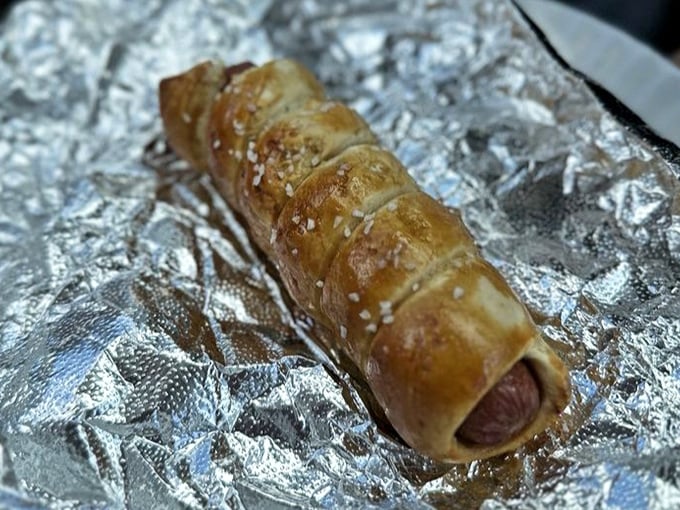 The pretzel dog—where America's ballpark favorite gets the Pennsylvania Dutch treatment, wrapped in a golden blanket of chewy, salty goodness.
