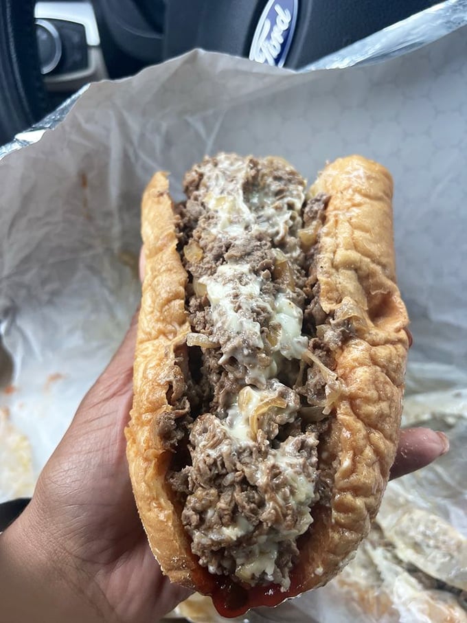 The cross-section reveals the beautiful marriage of meat and melted cheese – a relationship more harmonious than most Hollywood romances.