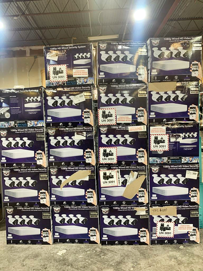 Security camera systems stacked to the ceiling—because apparently even bargain hunters need to protect their newfound treasures!
