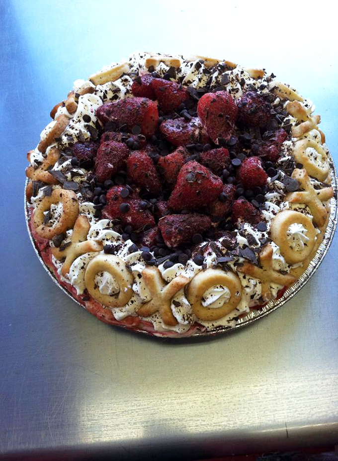 Behold the strawberry masterpiece that makes grown adults debate whether to photograph it or face-plant directly into its creamy depths.