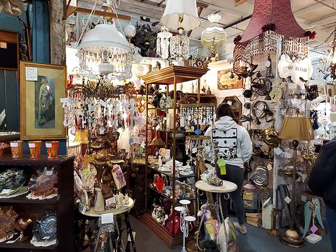 Chandeliers dangle like crystallized memories in this booth where shoppers hunt for that perfect piece of illuminated history. 