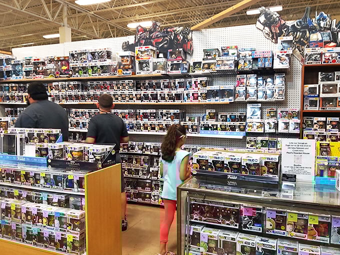 The modern treasure hunt in action. These collectors scan shelves of pop culture figures with the focus of archaeologists discovering a new civilization.